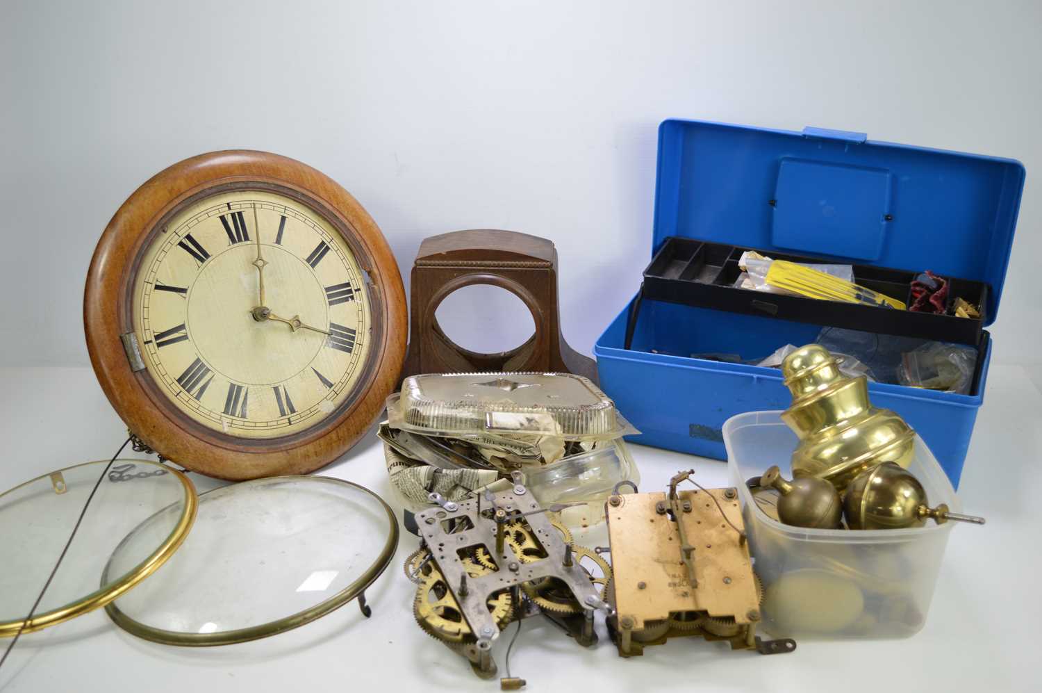 Lot 202 - A group of clock spares and some tools to